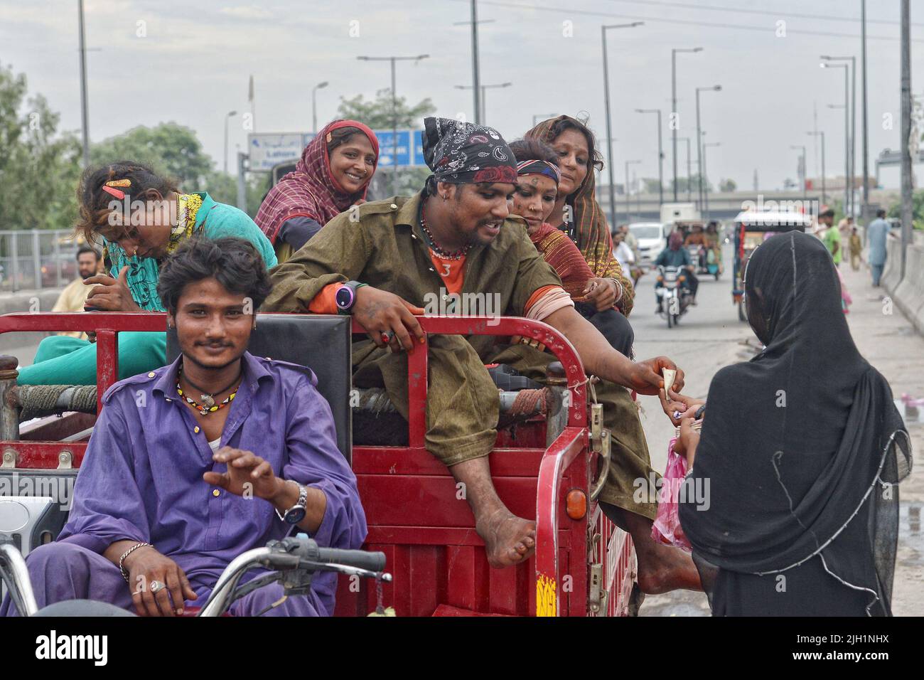 Lahore, Pakistan. 13th July, 2022. Pakistani people are busy in their ...