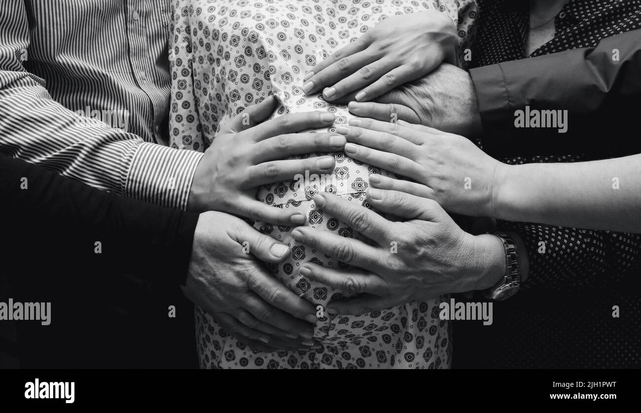Cropped image of beautiful pregnant woman, her handsome husband and ...
