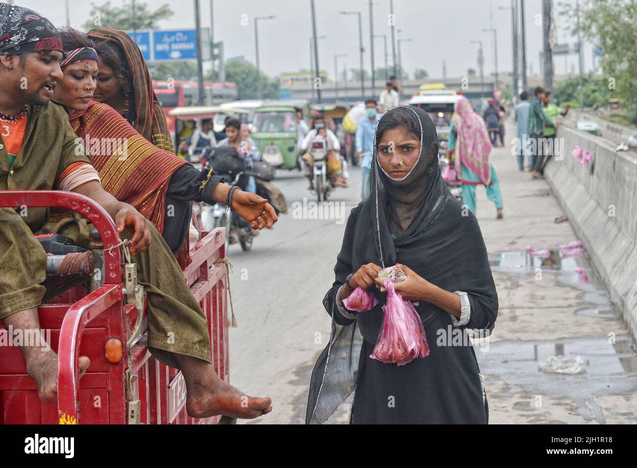 Lahore, Punjab, Pakistan. 13th July, 2022. Pakistani people are busy in ...