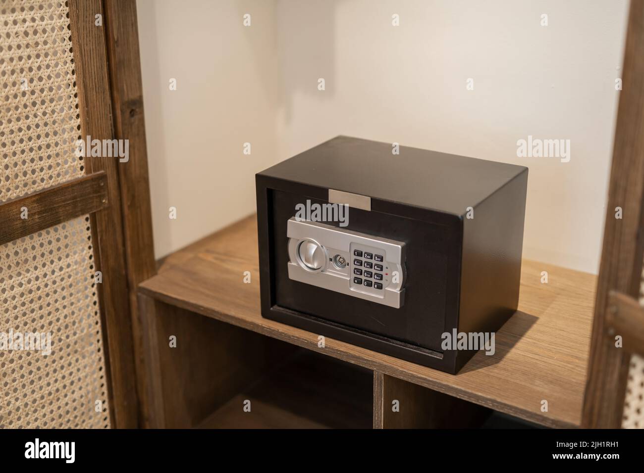 closed safe on shelf of cabinet in hotel room Stock Photo - Alamy