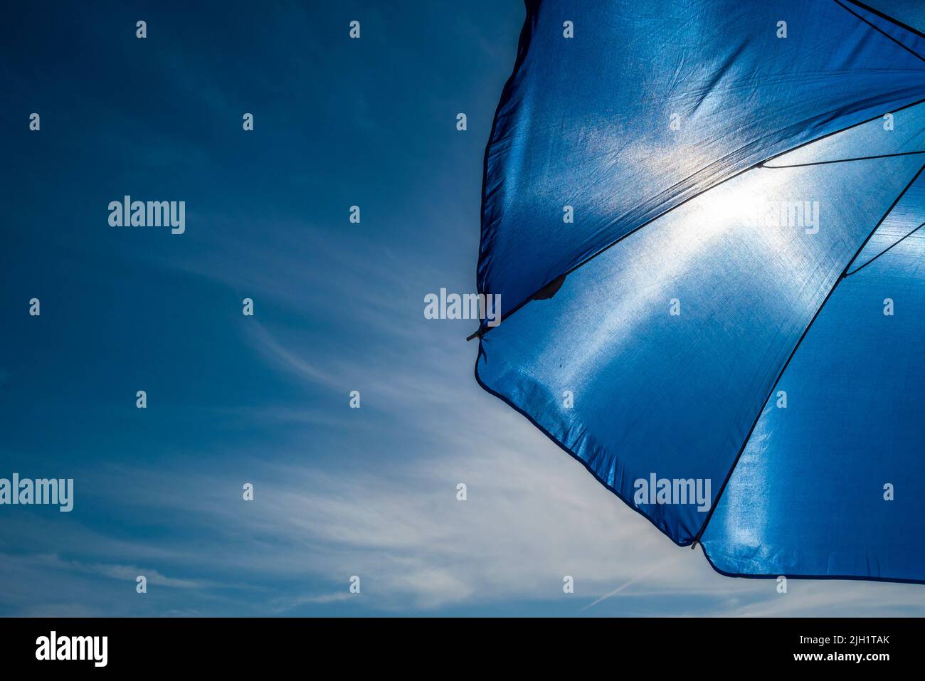 Vibrant blue umbrella hi-res stock photography and images - Alamy