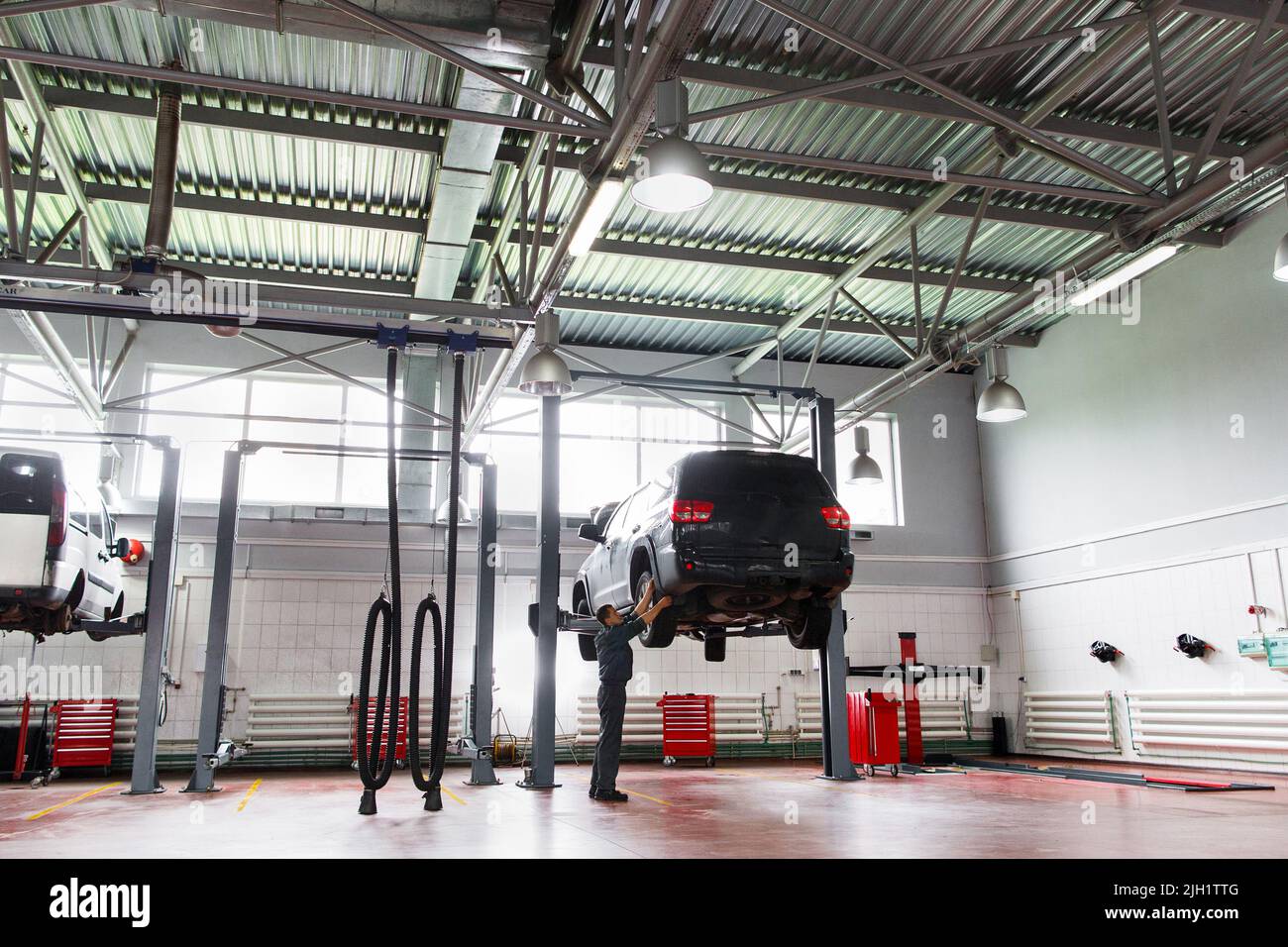 SUV maintenance at professional service station Stock Photo - Alamy
