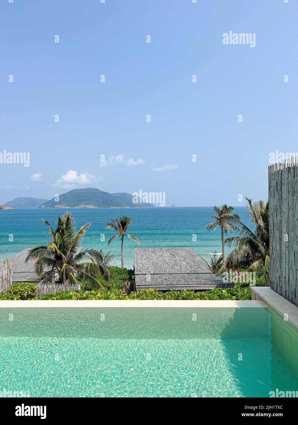 Private swimming pool on beach with amazing view of the azure ocean ...