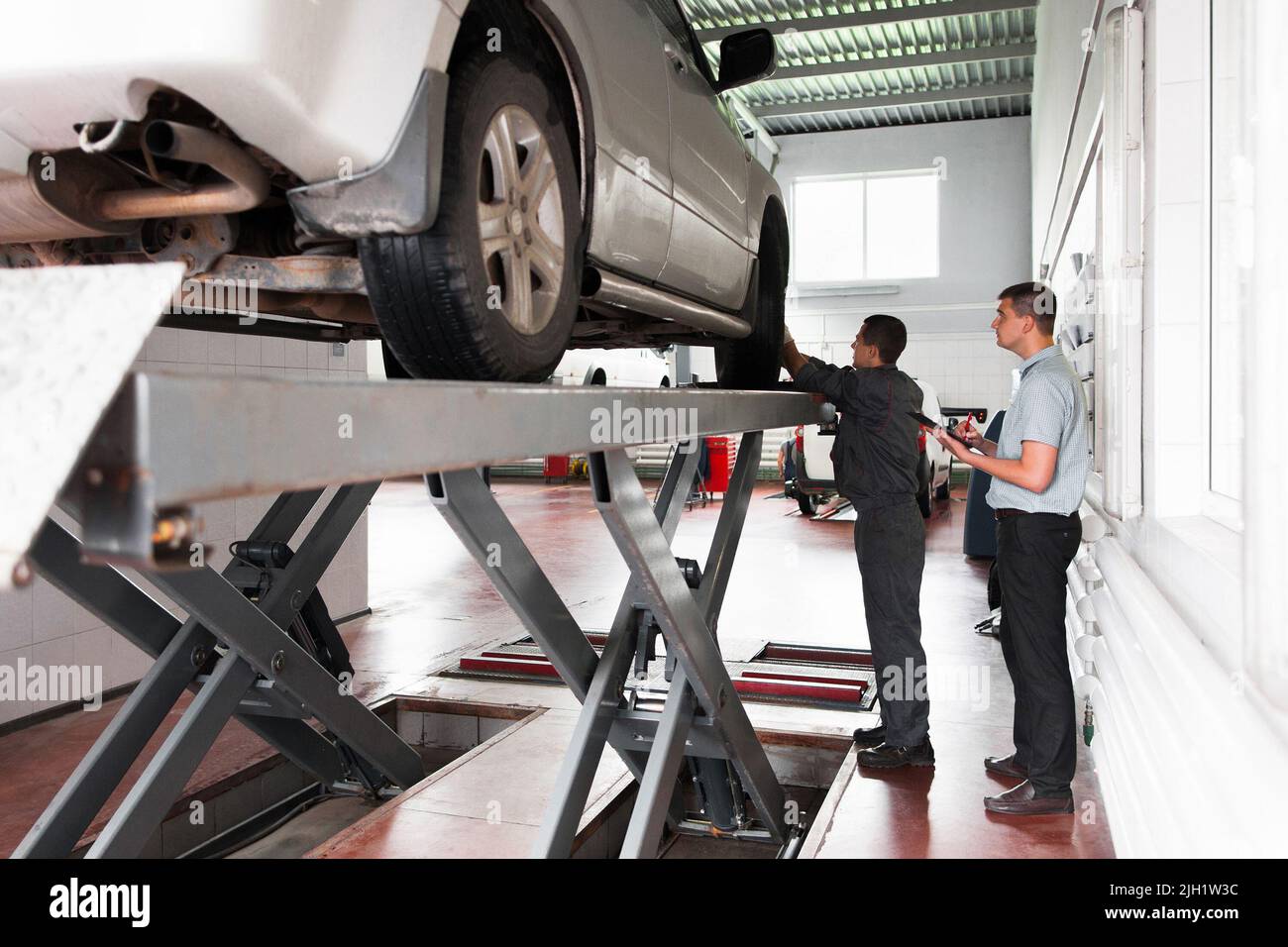Car suspension system inspection at workshop Stock Photo - Alamy