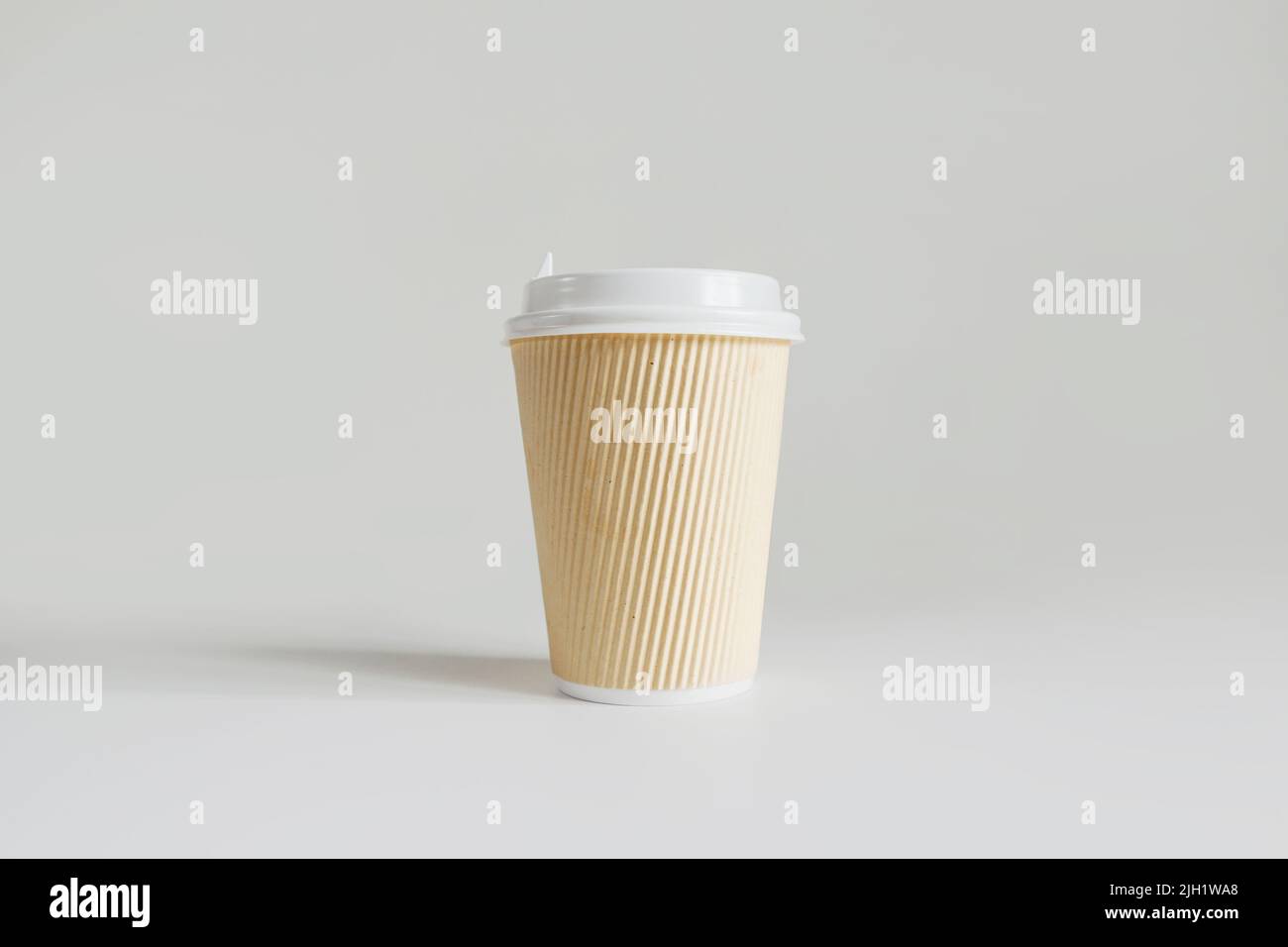 corrugated take away paper cup with plastic white lid mockup. Undyed ...