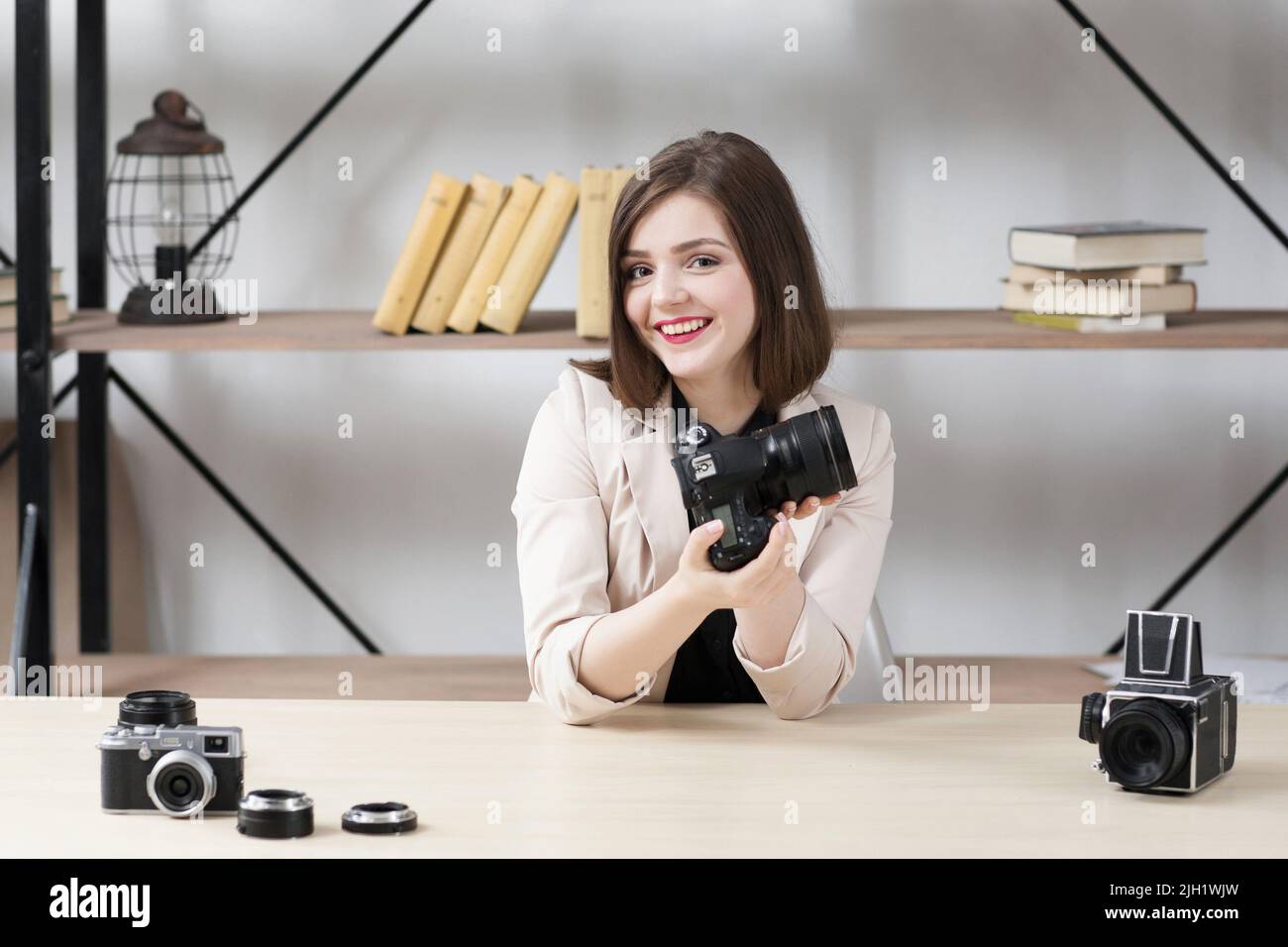 New photo camera presentation, blogger show Stock Photo - Alamy