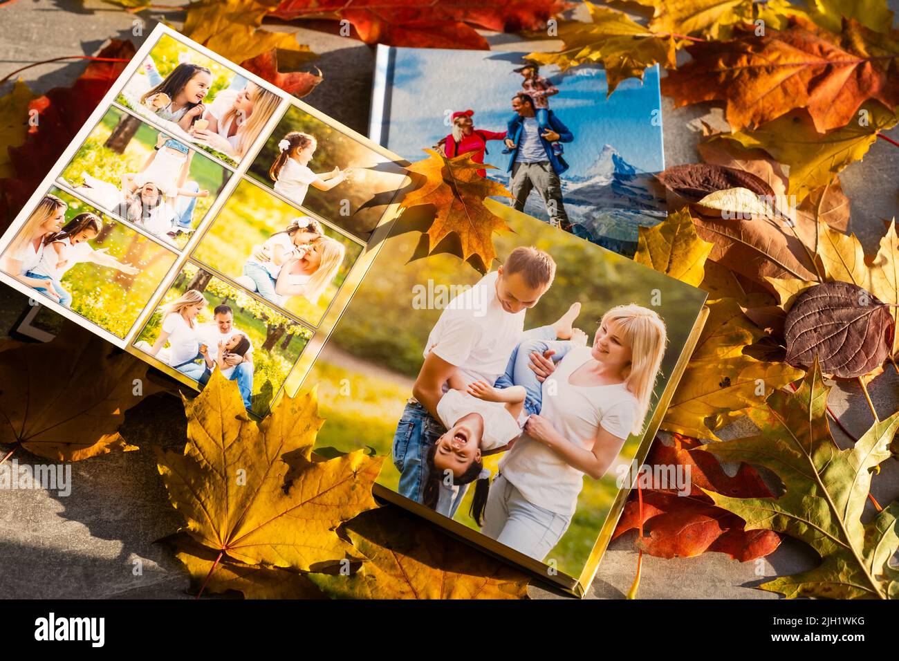 Autumn yellow leaves and family photobook. fall leaves arranged for a ...