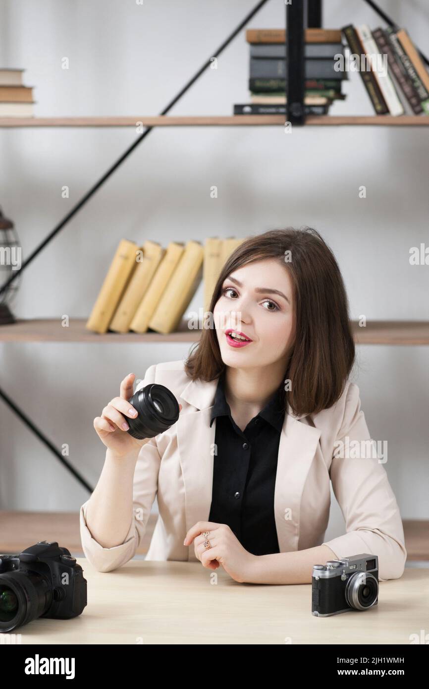 Female blogger tells interesting fact about photo Stock Photo - Alamy