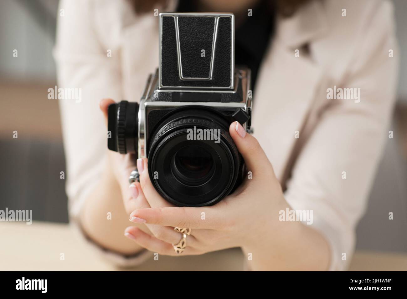 Close-up photo of retro camera in female hand Stock Photo - Alamy