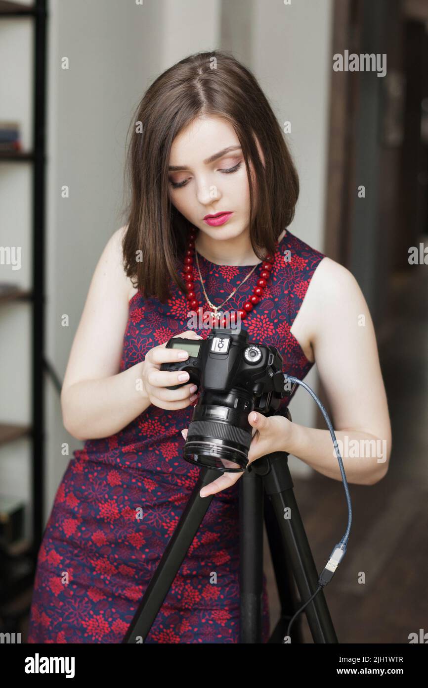 Young woman tuning camera on hi-res stock photography and images - Alamy