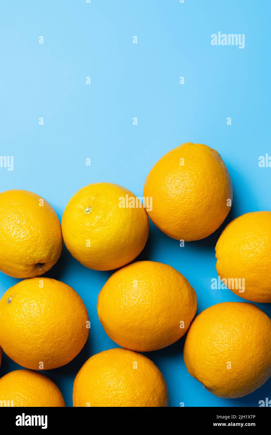 Top view of natural oranges on blue background with copy space Stock ...