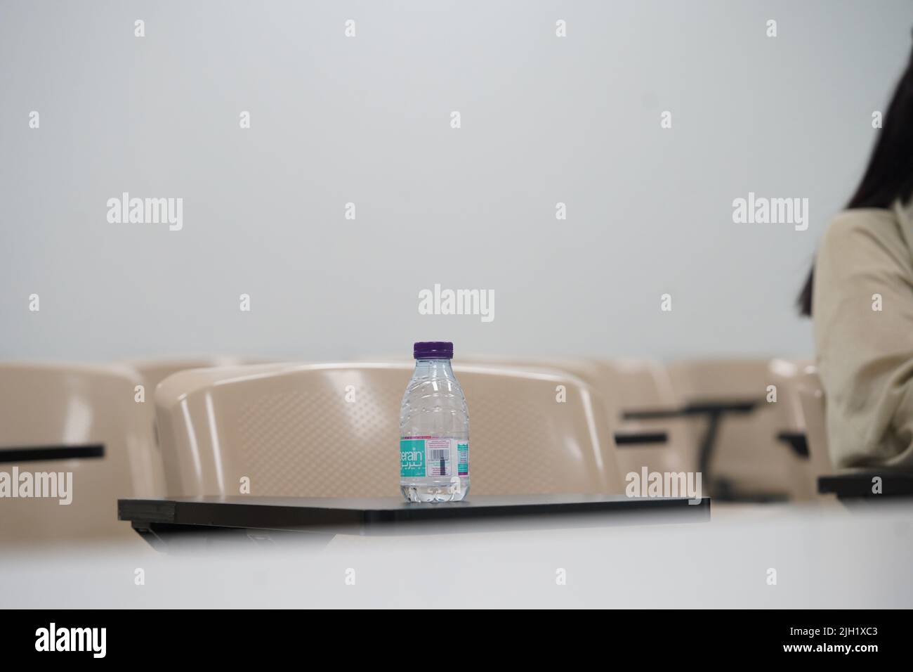 Empty class at university or school with chairs and side table, also a ...