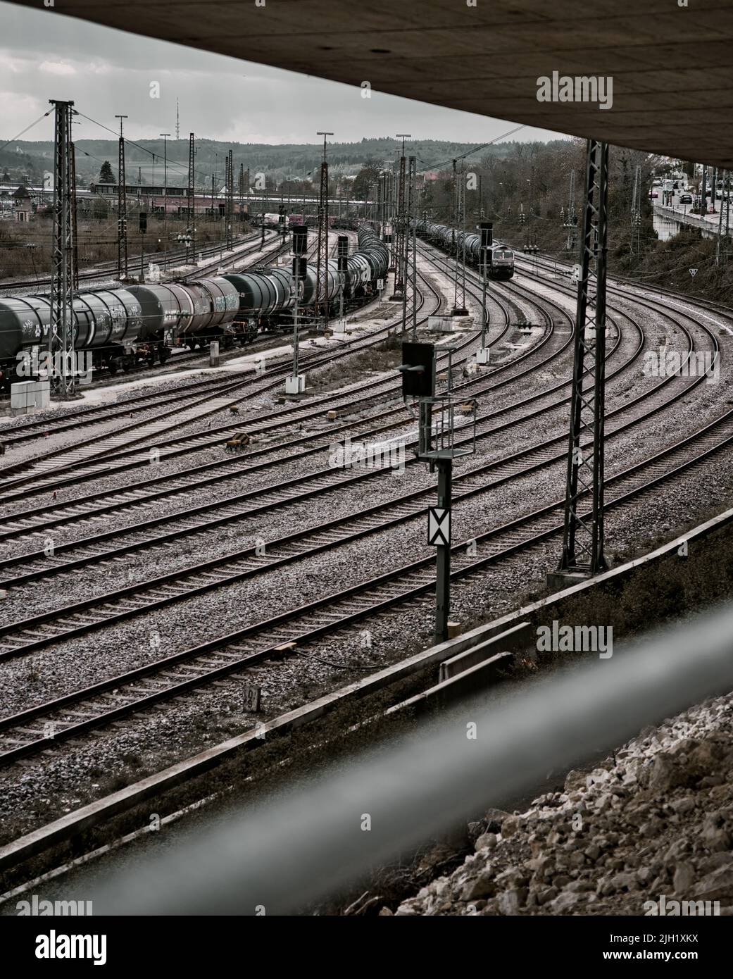 The vertical monochrome view of the train railways Stock Photo - Alamy