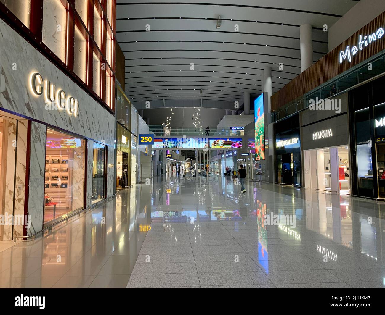 An inside shot of an empty Incheon International Airport with shops in ...