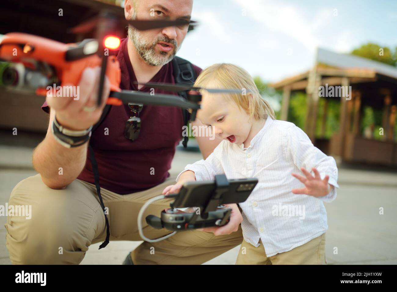 Son father remote controller hi-res stock photography and images - Alamy