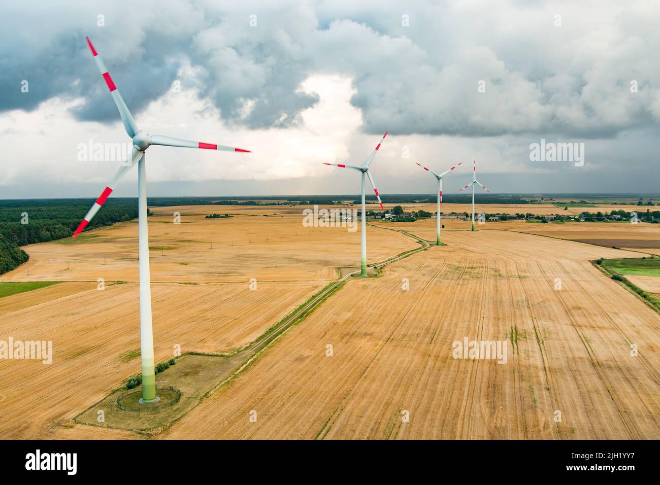 Aerial view of wind turbines generating power, located in Lithuania, on ...