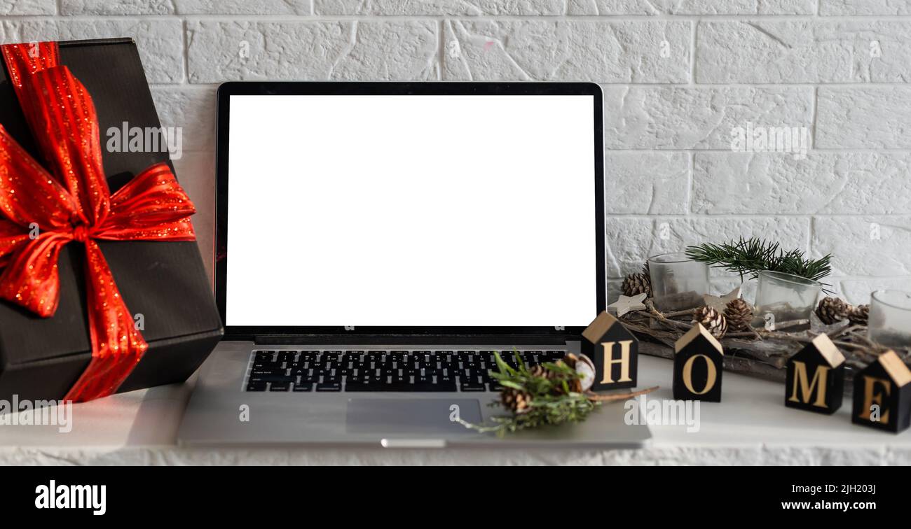 Laptop computer with white blank empty mock up screen on Merry ...