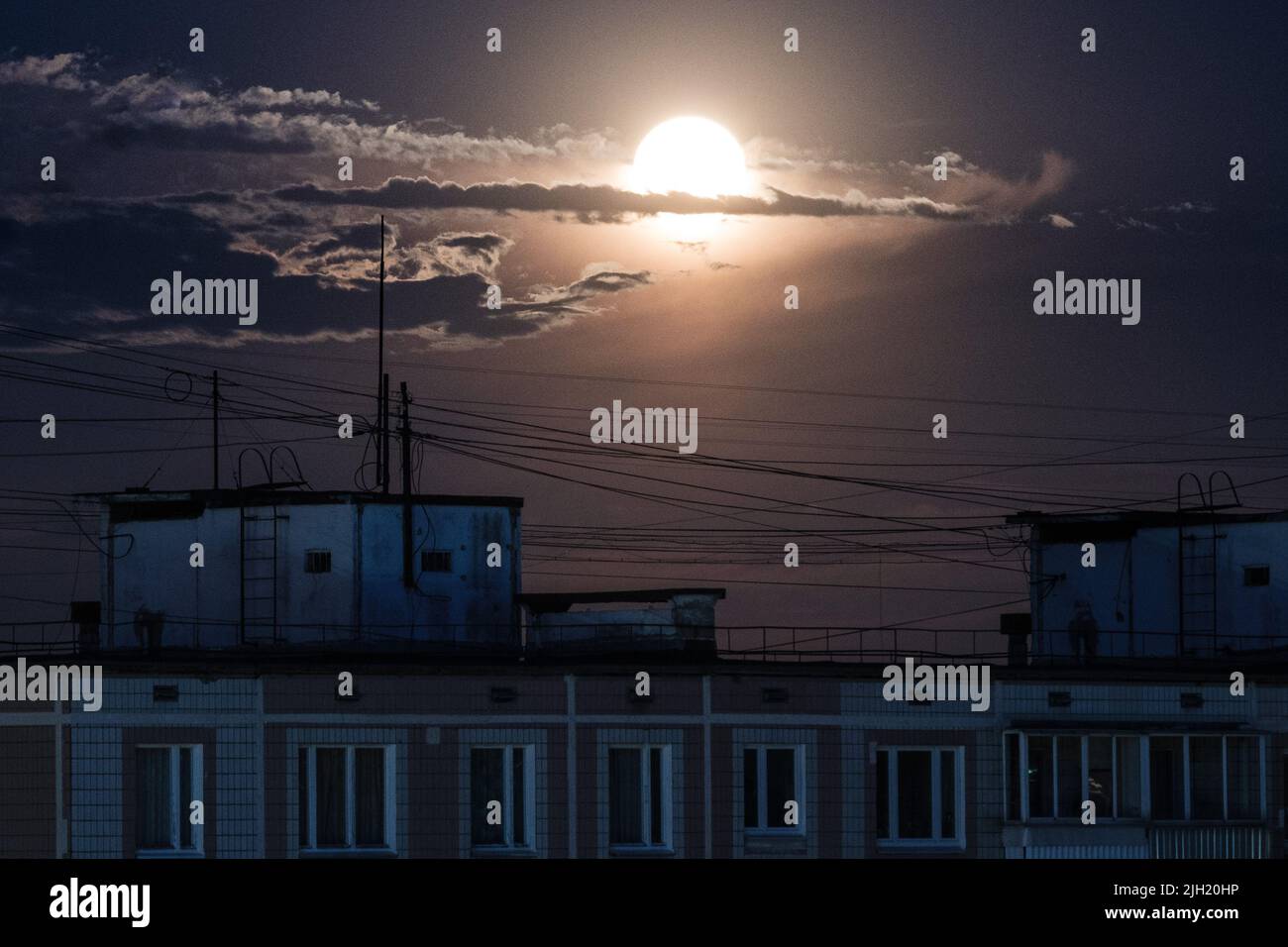 Super moon over an apartment building in Moscow Stock Photo - Alamy