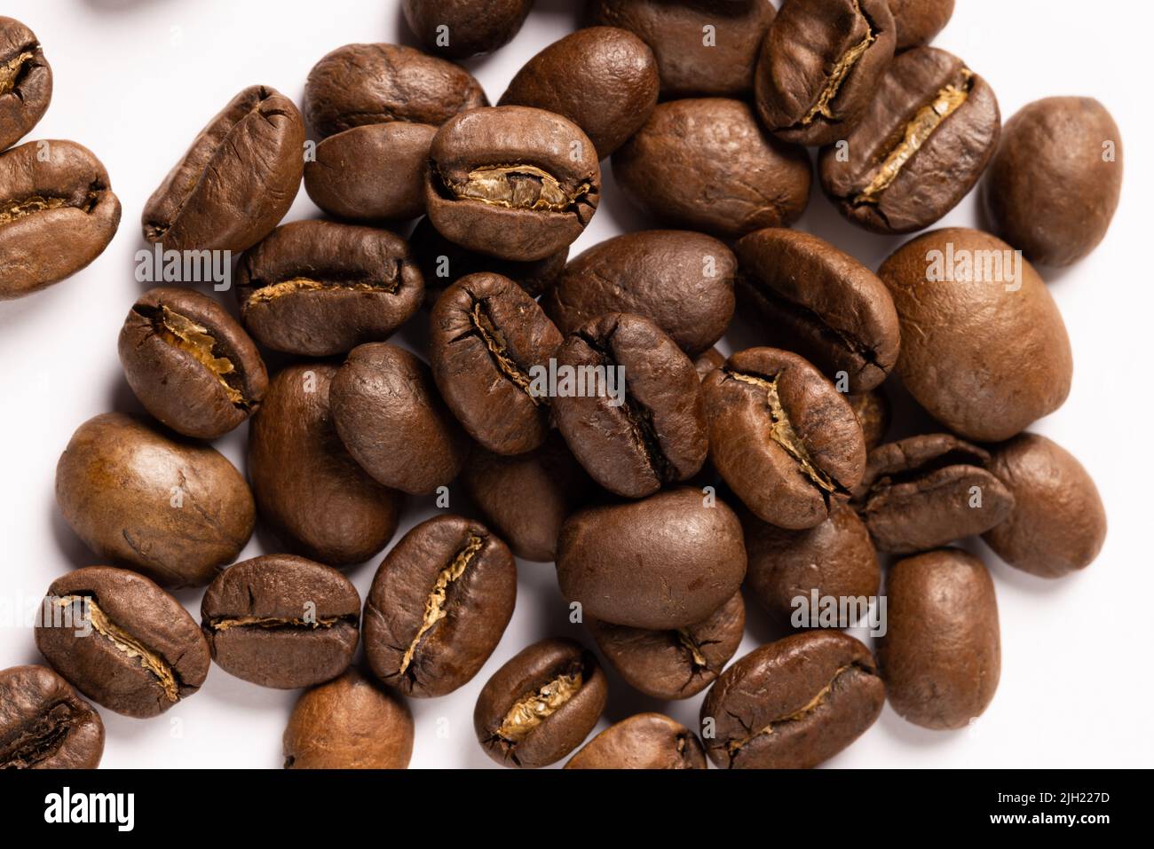 Image of pill of a coffee beans on a white background Stock Photo - Alamy