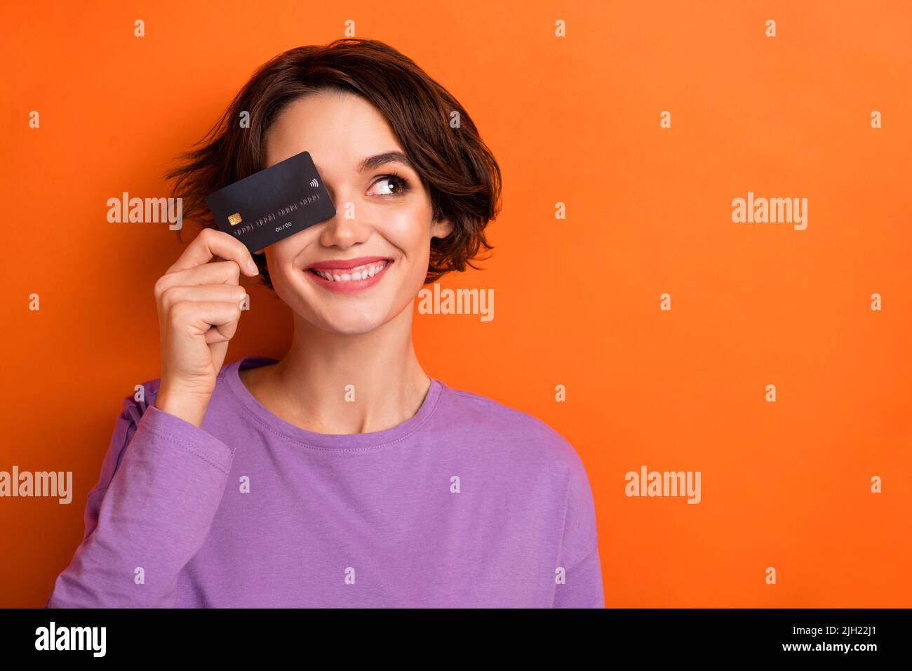 Photo of funny shy lady wear violet sweatshirt spectacles credit card ...