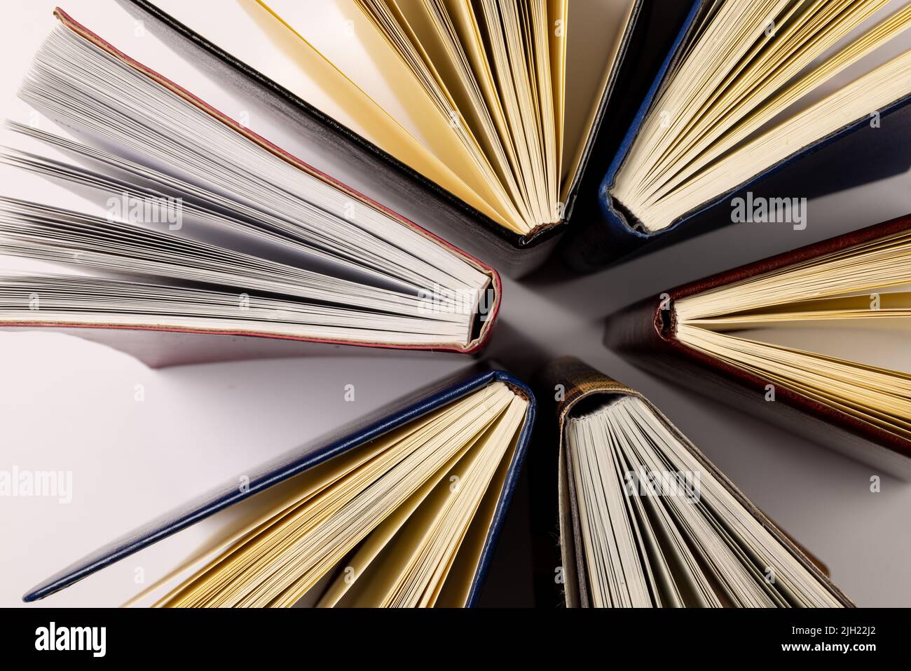 Image of central composition with books standing on white surface Stock ...