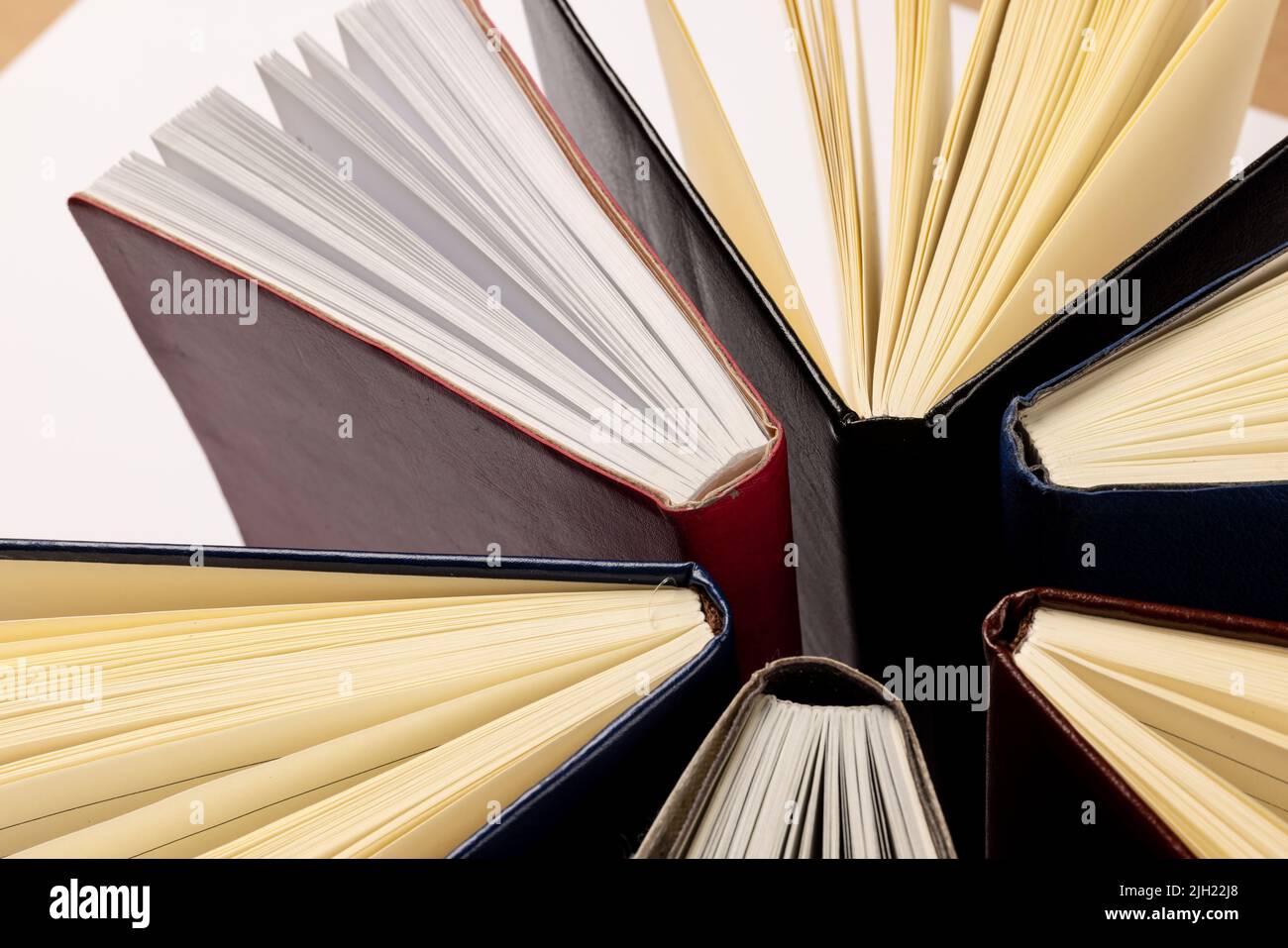 Image of central composition with books standing on white surface Stock ...