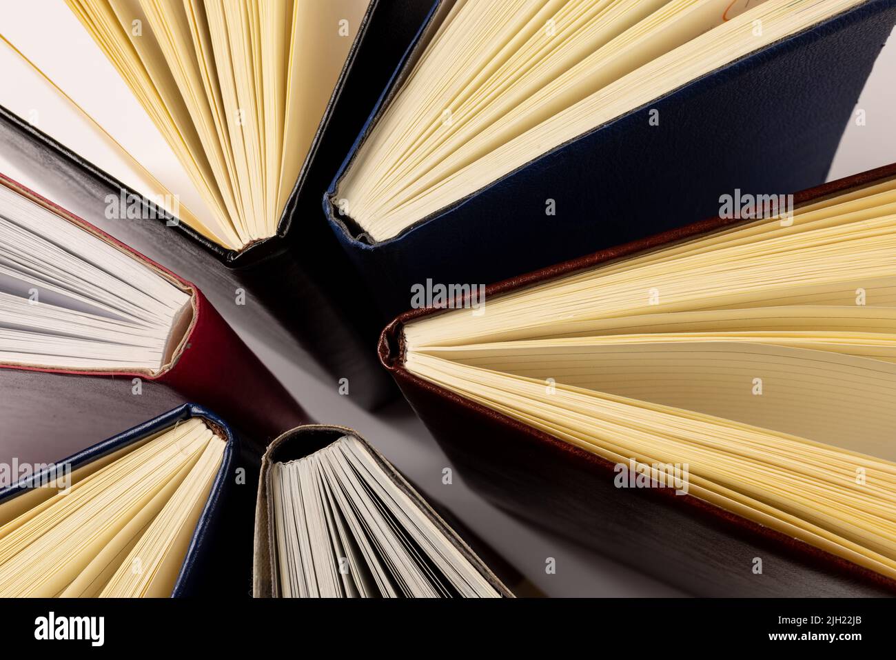 Image of central composition with books standing on white surface Stock ...