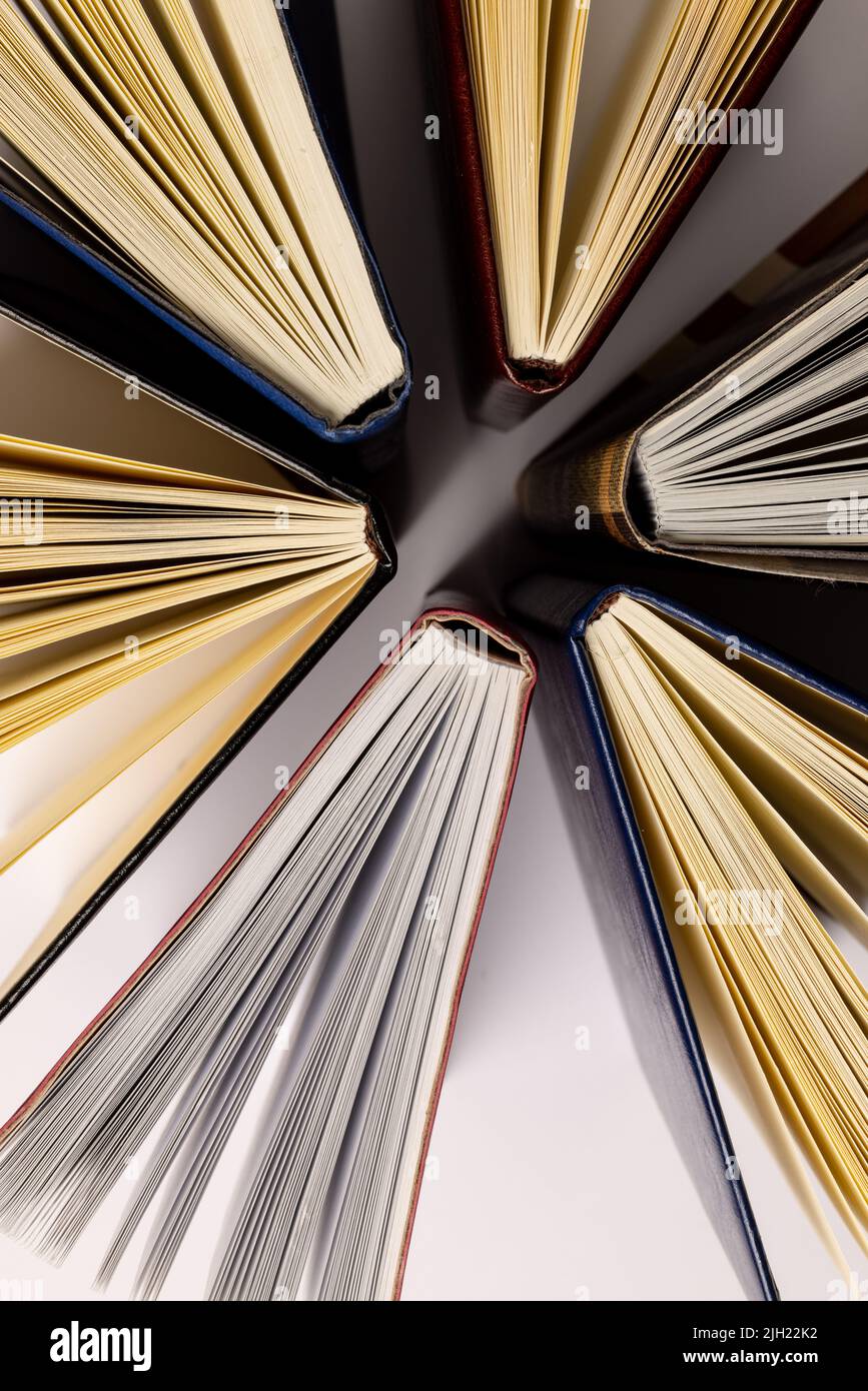 Image of central composition with books standing on white surface Stock ...