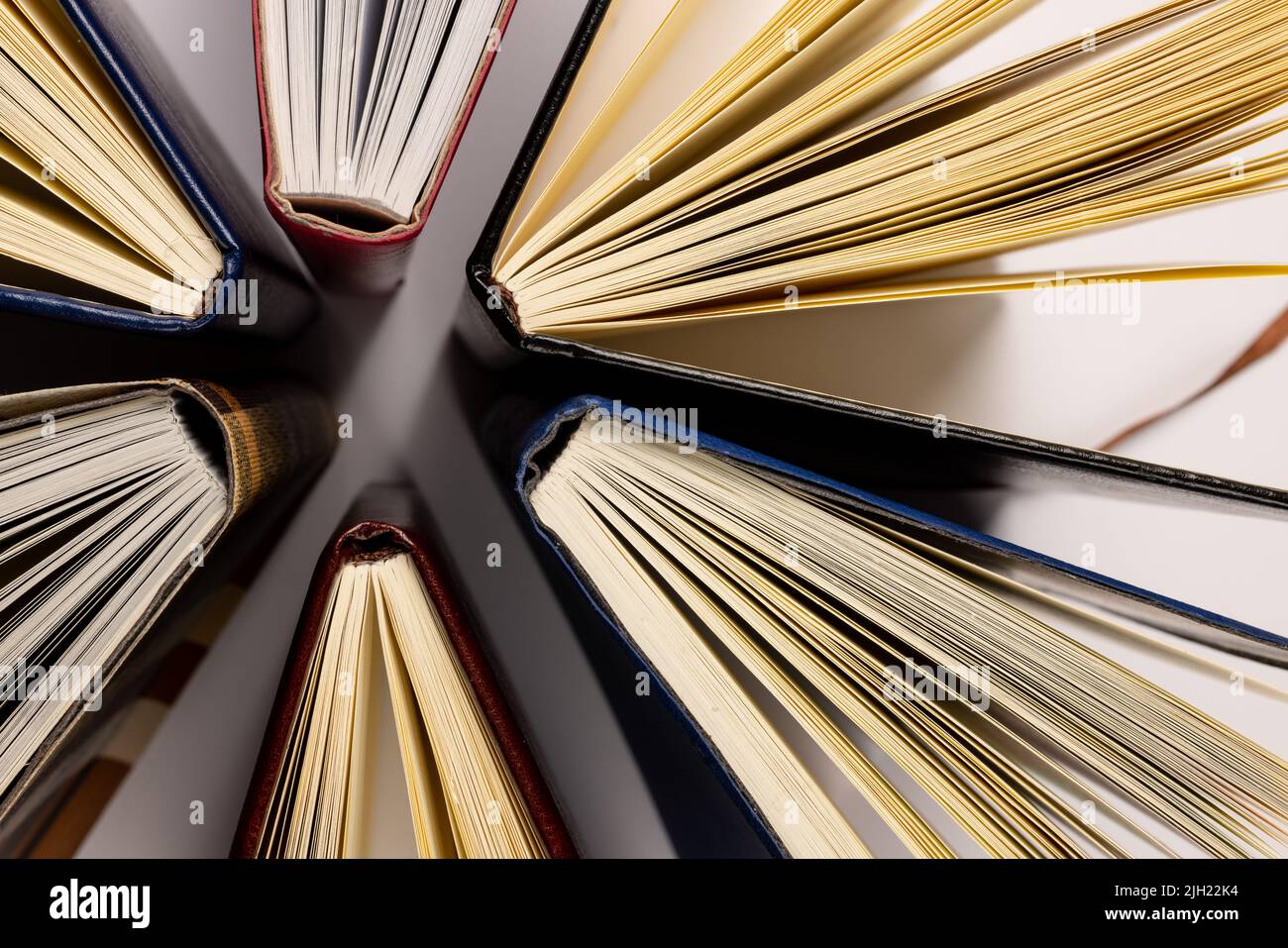 Image of central composition with books standing on white surface Stock ...