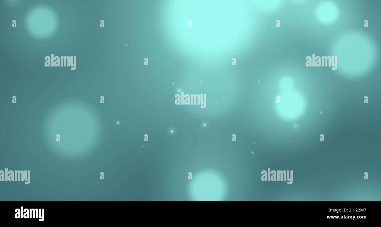 Image of light spots over green background Stock Photo - Alamy