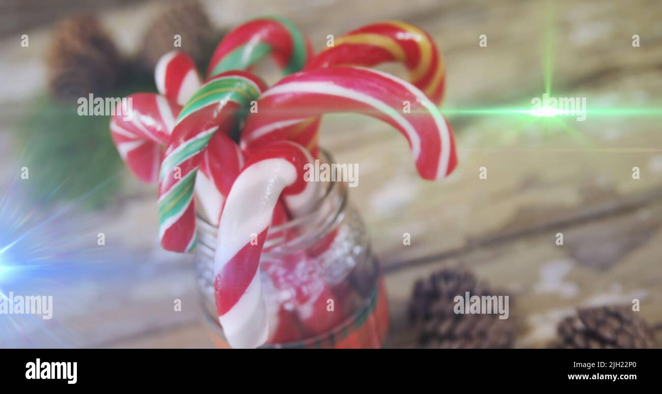 Image of light spots over candy canes Stock Photo - Alamy