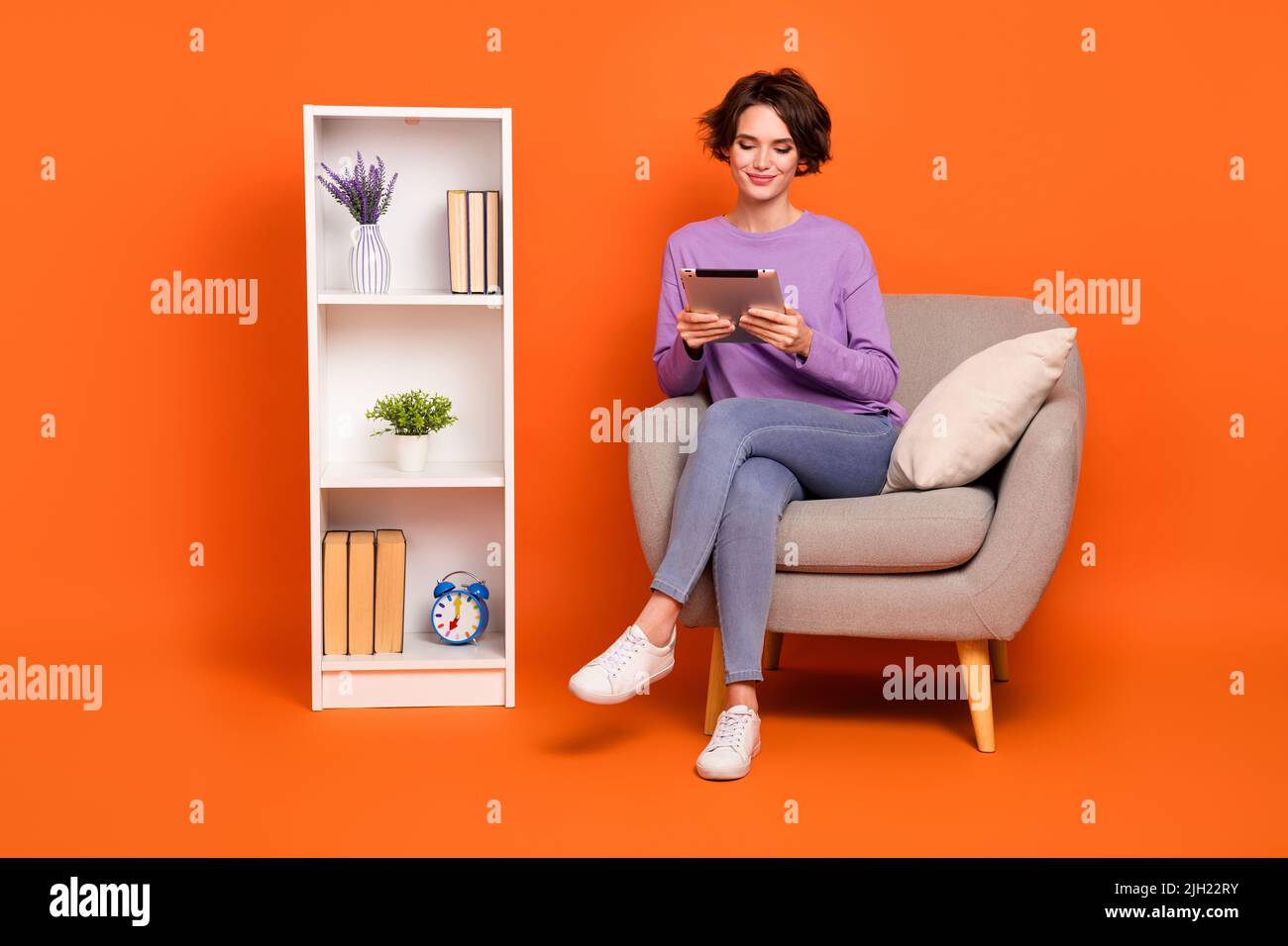 Full size portrait of charming person sitting chair use tablet typing ...