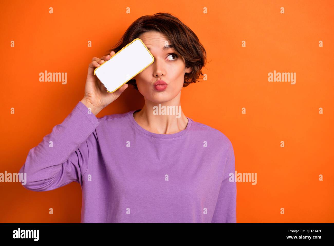 Photo of pretty flirty girl dressed purple pullover modern gadget empty ...