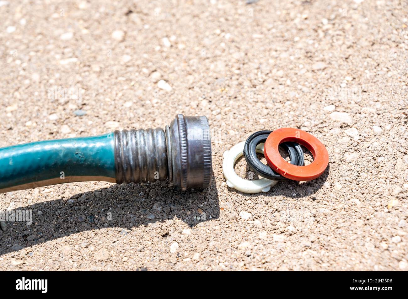 New rubber gasket being replaced in a garden hose female connection to ...