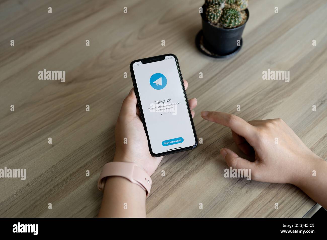 CHIANG MAI, THAILAND, JUL 12, 2022 : Woman hand holding iPhone X with ...