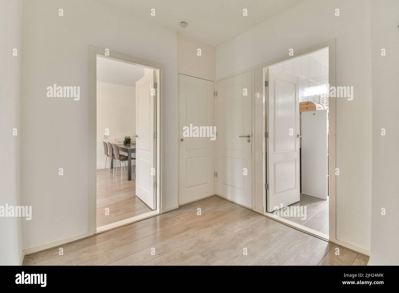 Room with door to balcony and narrow long corridor in perspective in ...