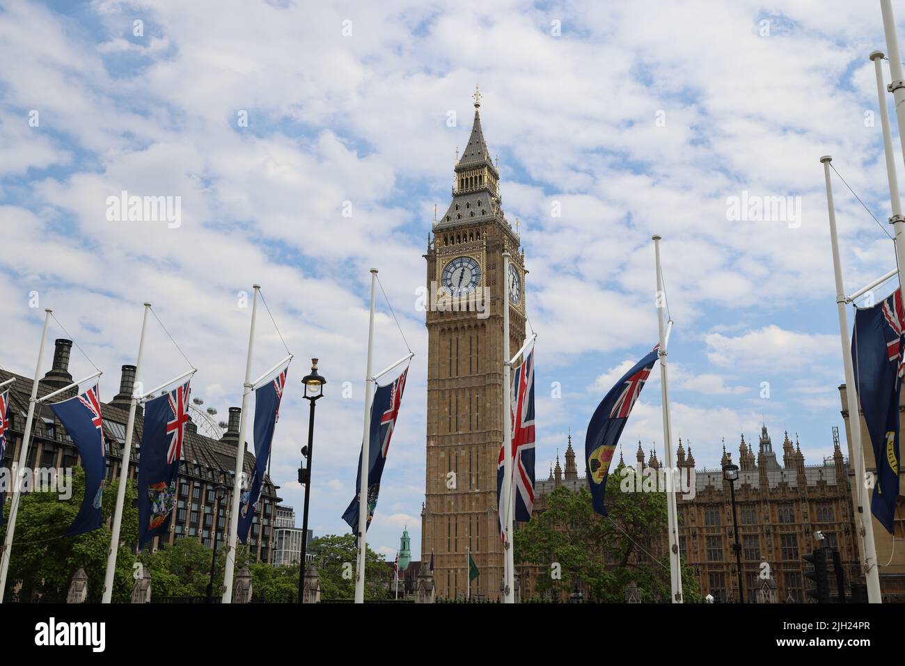 The flags of Parliament Square with Big Ben in the background, London ...