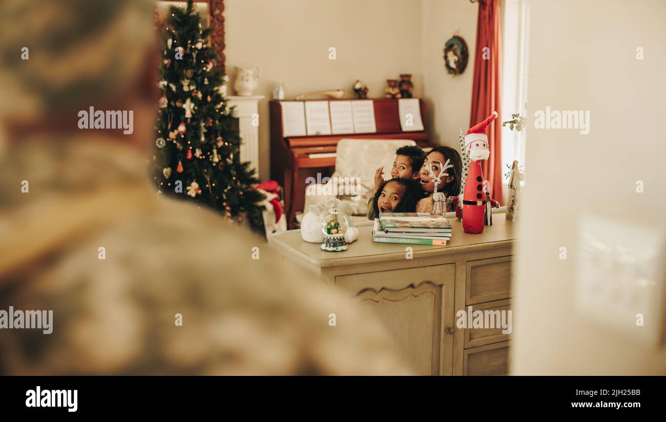 Army soldier making a surprise homecoming. Military man returning to ...