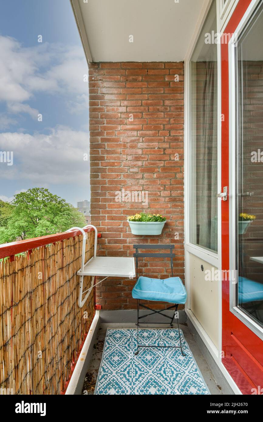 Sitting area in balcony with comfortable furniture around beautiful ...