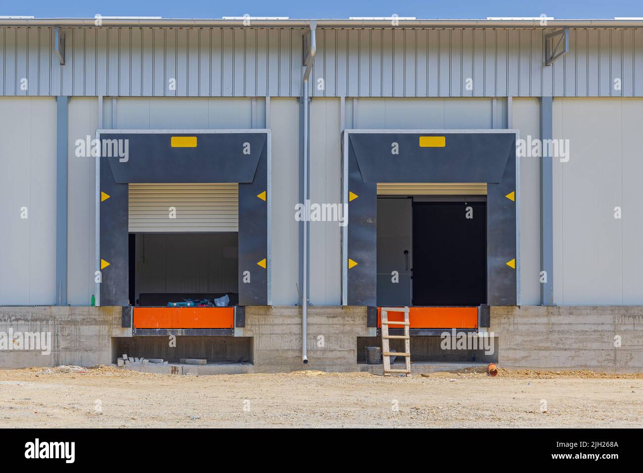 Wooden Ladder at Loading Dock Doors Warehouse Building Stock Photo - Alamy