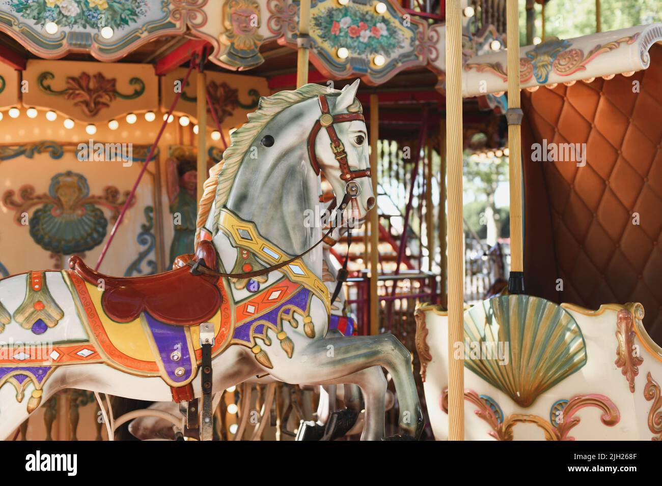 Horses on a carnival Merry Go Round.Carousel Stock Photo - Alamy