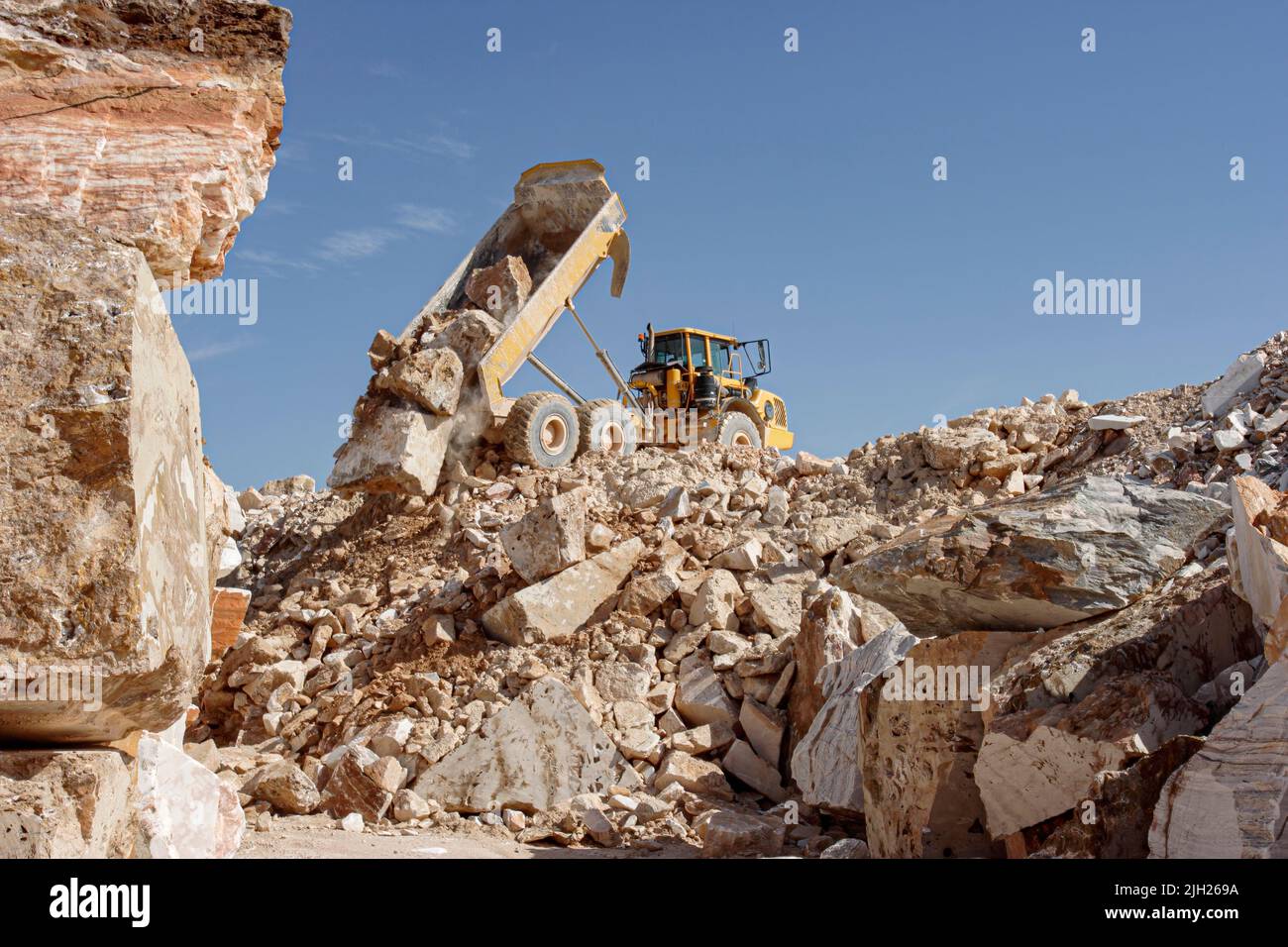 Heavy truck unloading stone in a marble quarry, Estremoz, Portugal ...