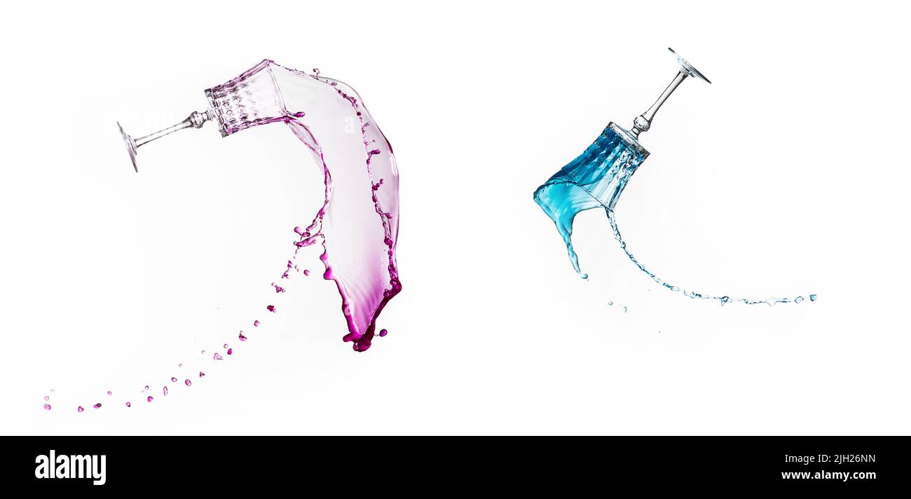 Two spinning glass in motion with pink and blue coloured liquid ...