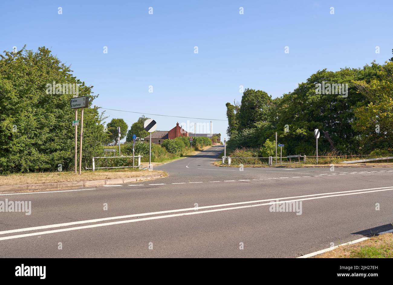 Deserted country road junction example Stock Photo - Alamy