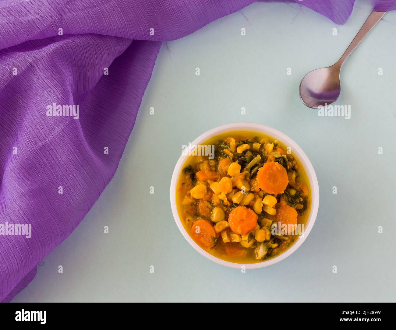 Top view,closeup of vegetable stew bowl,isolated on light blue ...