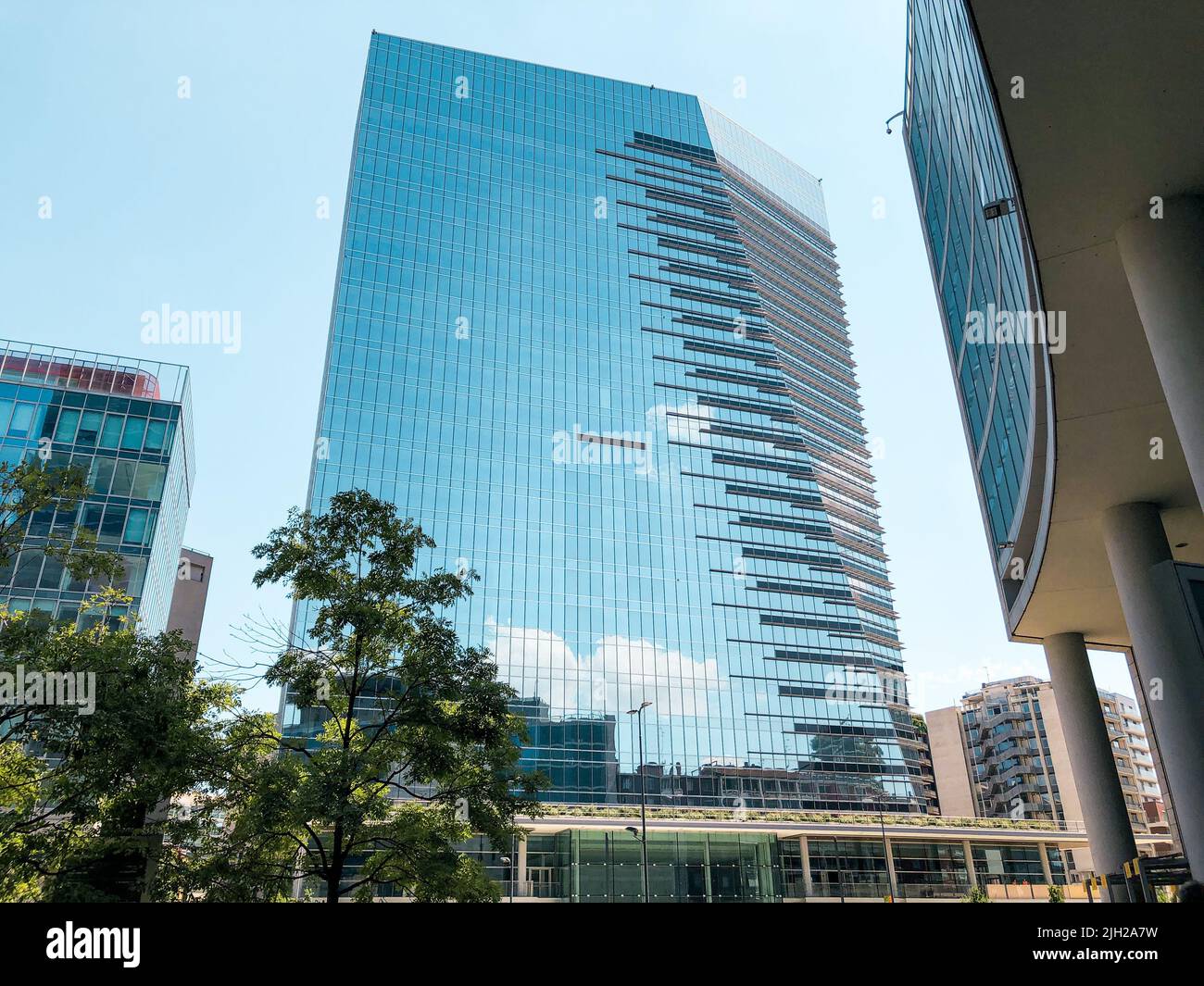 Glass and steel structure of a building in the center of Milan. View of ...