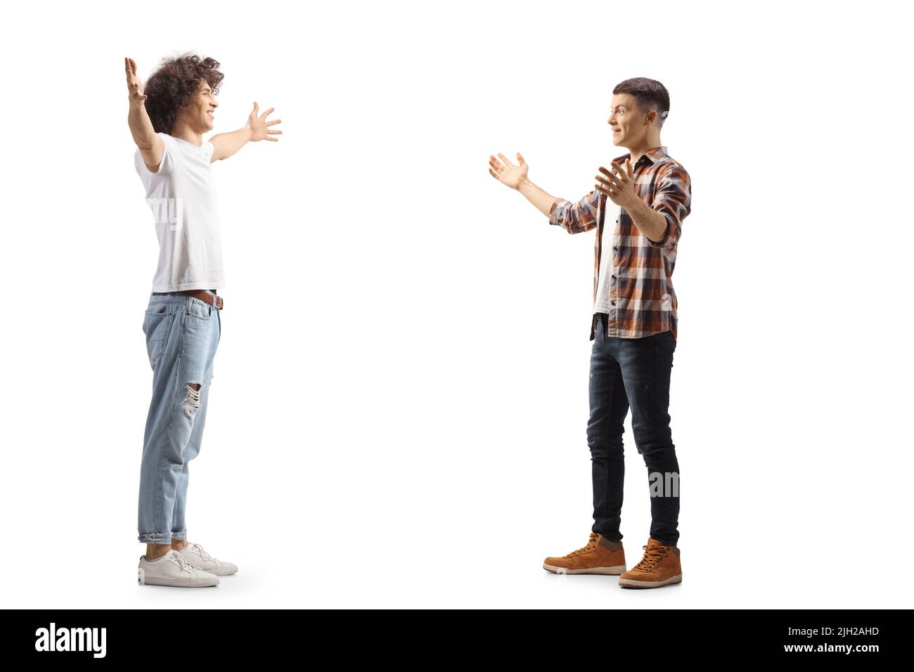 Two happy guys meeting each other isolated on white background Stock ...