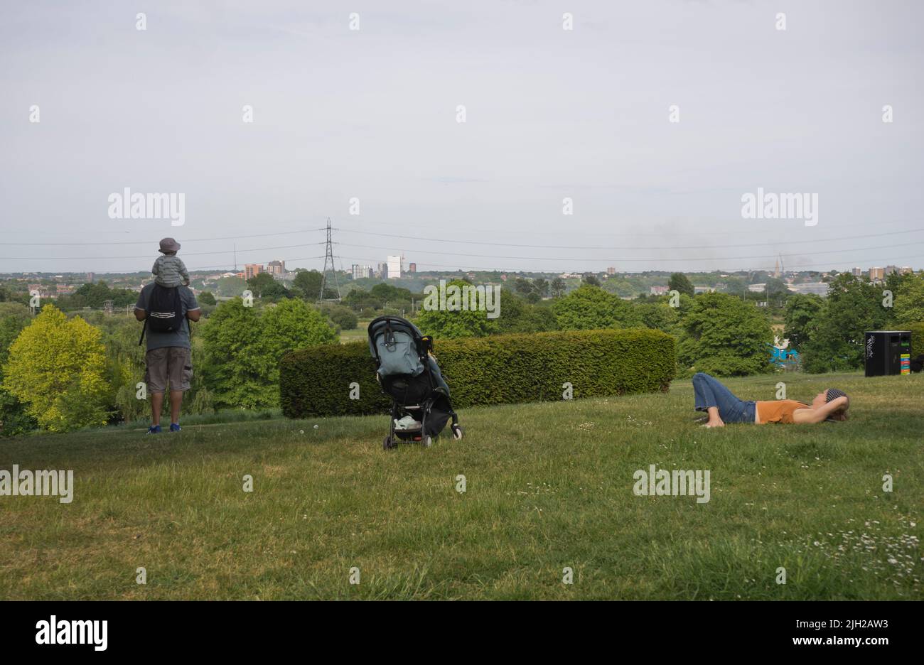 People enjoying sunshine in Springfield park in Hackney,London,England ...