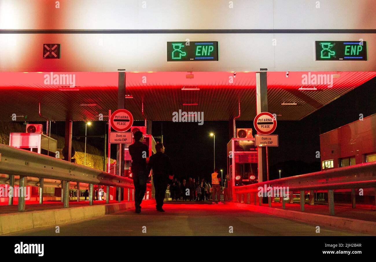 Podgorica. 13th July, 2022. People walk through a toll booth of the ...