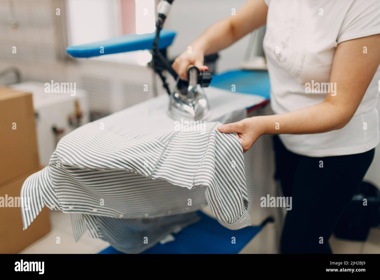 Dry cleaning clothes. Clean cloth chemical process. Laundry industrial dry-cleaning factory ...